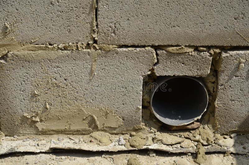 A Plastic Pipe is Stretched through the Technological Hole in the Wall ...