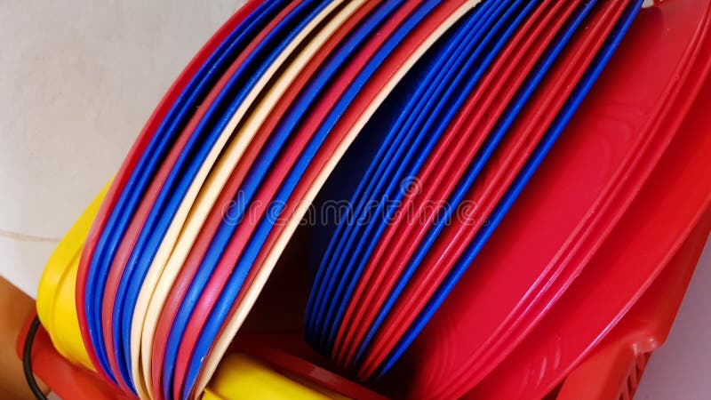 Plastic Plates in Different Colors Stack Together Stock Image - Image ...
