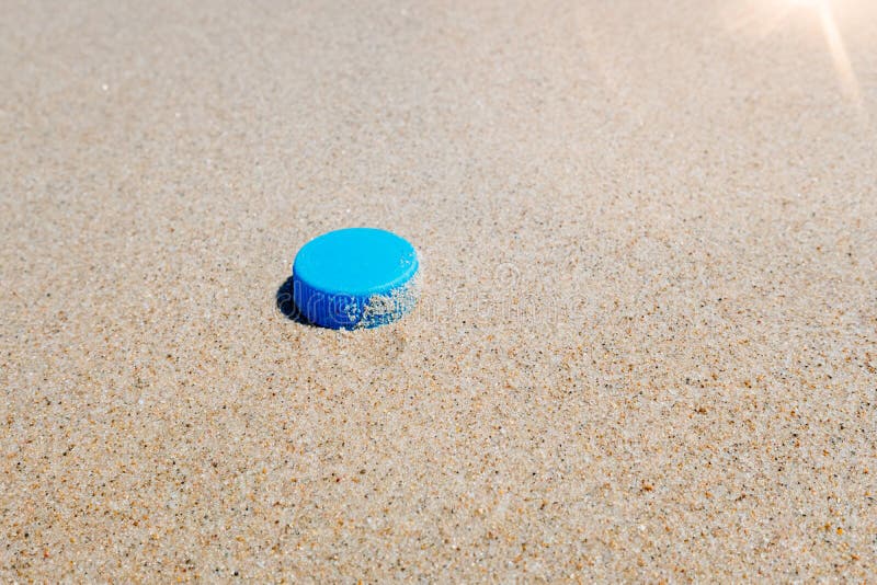 Plastic Plug on the Clean Sand of a Beach Stock Image - Image of ...