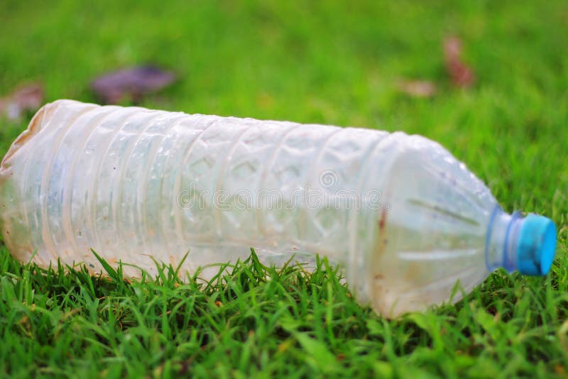 Plastic Pollution - Plastic Bottle is Fallen Down in the Grass Stock ...