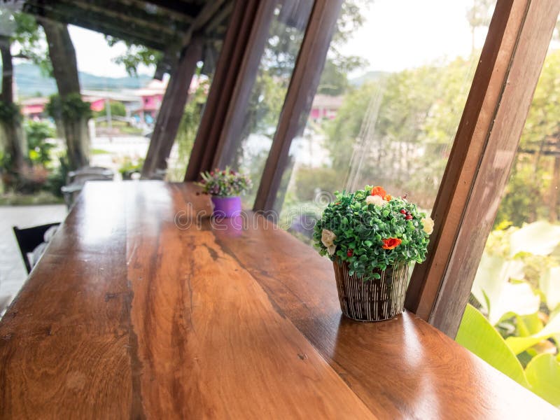 Plastic Pot with Flower on the Wood Table are Decoration Stock Photo ...