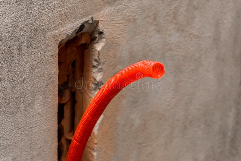 Plastic PVC Pipe Insulation Material on Construction Concrete Home Wall ...