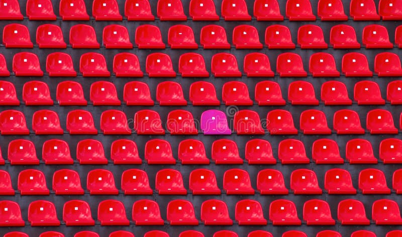 Plastic Red and One Pink Seats on Football Stadium Stock Photo - Image ...