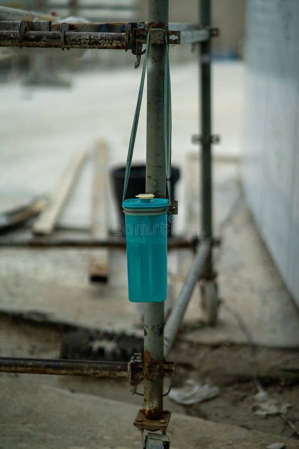 Plastic Reusable Water Bottle Hanging at a Construction Site Stock ...