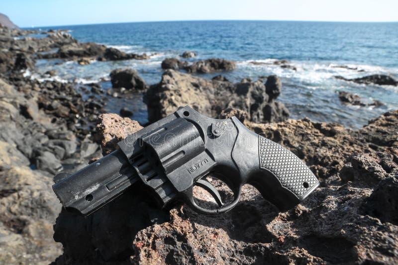 Plastic Revolver Toys On Black Background Stock Photo - Image of ...