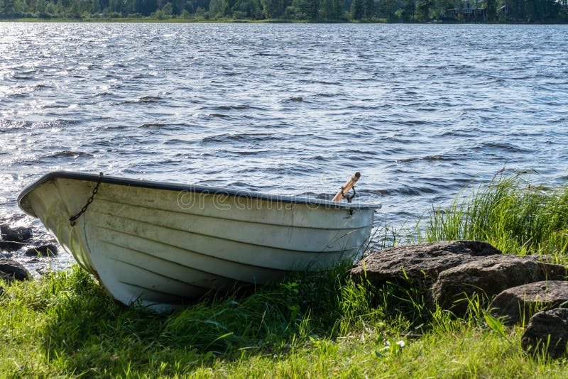 Plastic Rowing Boat Dragged Up on the Shore Stock Photo - Image of ...