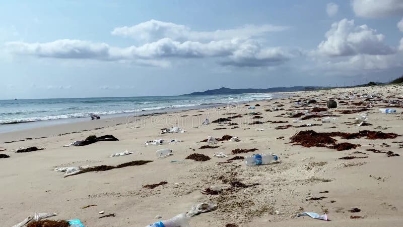 Plastic Rubbish Thrown on the Sandy Seashore, Trash on the Sea Beach ...