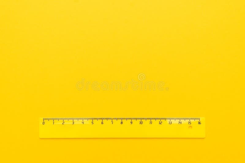 Yellow Plastic Ruler on the Yellow Background Stock Photo - Image of ...