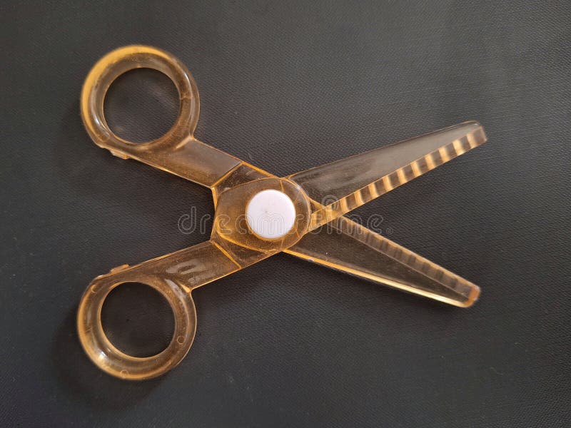 Plastic Scissors for Cutting Paper in Jagged Patterns. with a Dark Gray ...