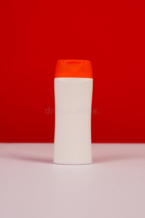 Plastic Shampoo Bottle with Flip-top Lid Isolated on Red and White ...