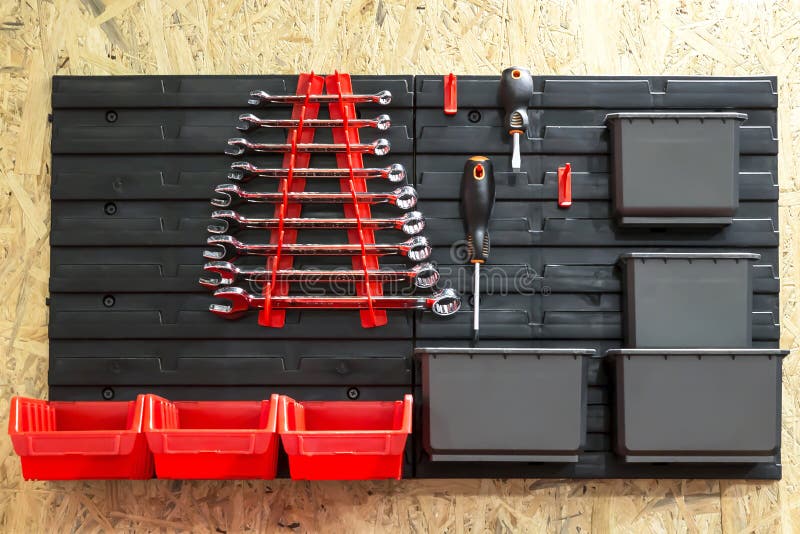 Plastic Shelf for Storing Working Tools on the Wall in the Workshop ...