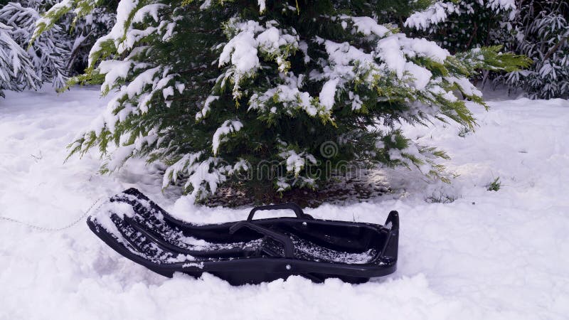 Plastic sled on the snow stock photo. Image of sledging - 363486134