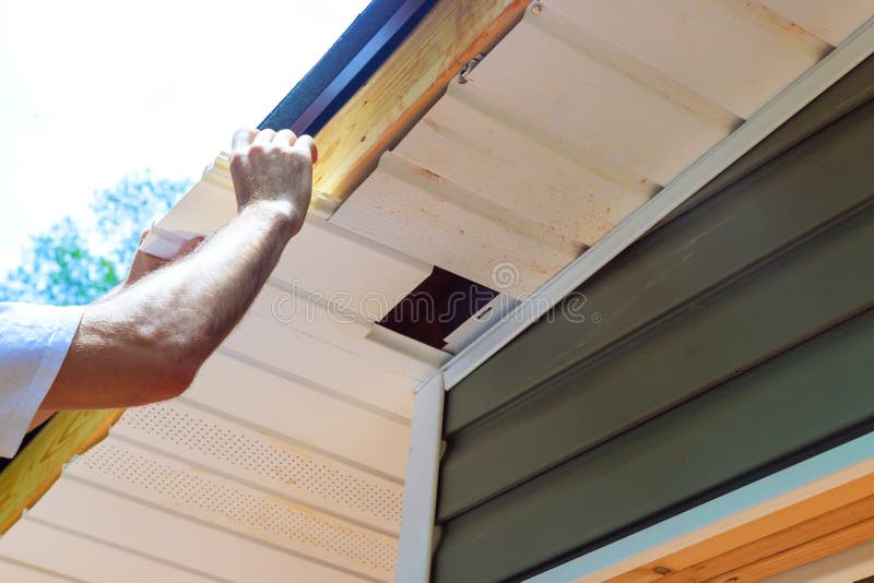 Plastic Soffit Boards are Mounted To Roof Rafters of a House Ceiling ...