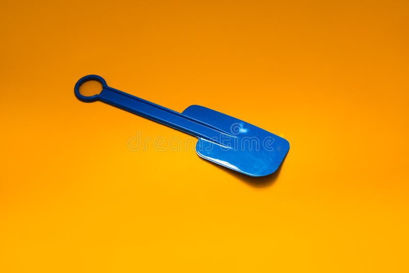 Plastic Spatula on Orange Background Stock Photo - Image of blue ...