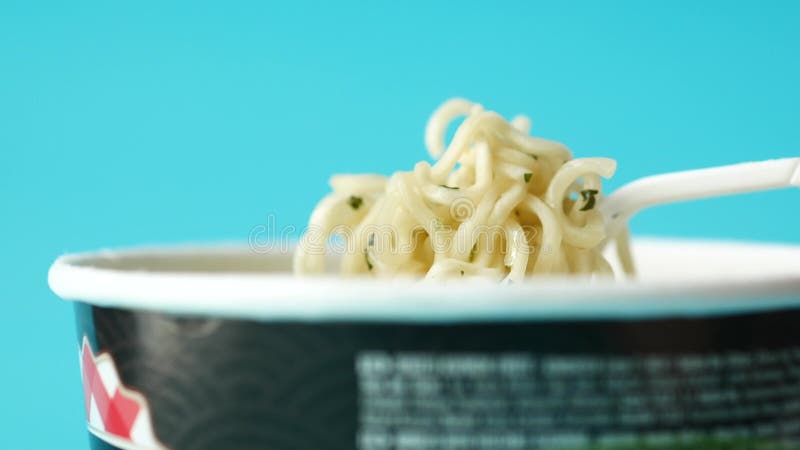 Plastic Spoon Pick Instant Noodles from Container Stock Footage - Video ...