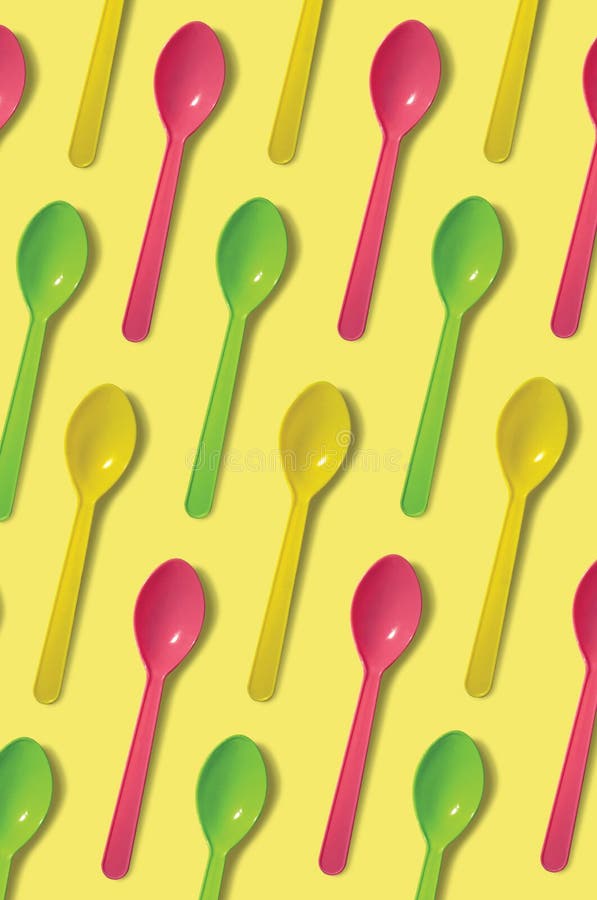 Plastic Spoons Pattern on Light Yellow Background Stock Image - Image ...