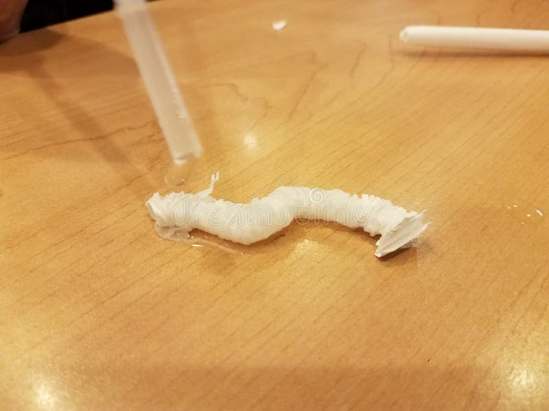 Plastic Straw and Wet Paper Straw Cover on Brown Wood Table Stock Image ...