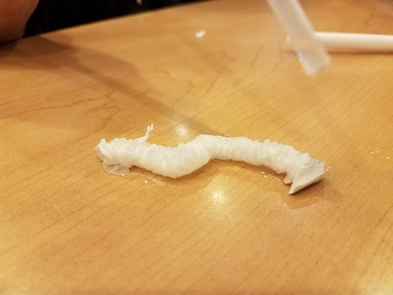 Plastic Straw and Wet Paper Straw Cover on Brown Wood Table Stock Image ...