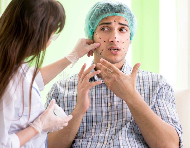 The Plastic Surgeon Preparing for Operation on Man Face Stock Photo ...