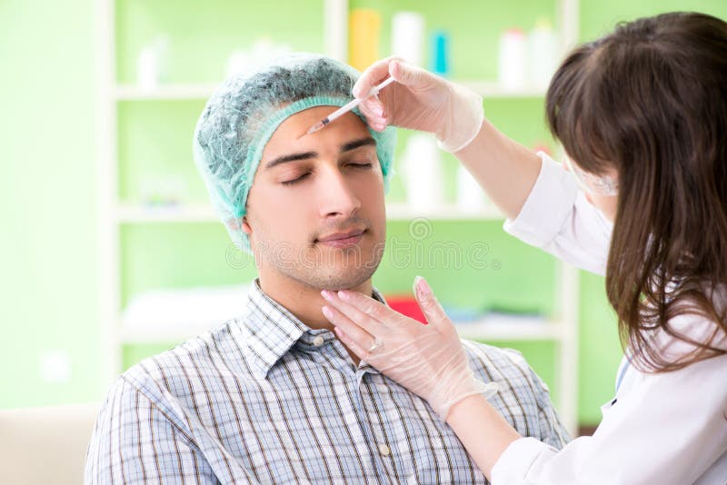 The Plastic Surgeon Preparing for Operation on Man Face Stock Photo ...