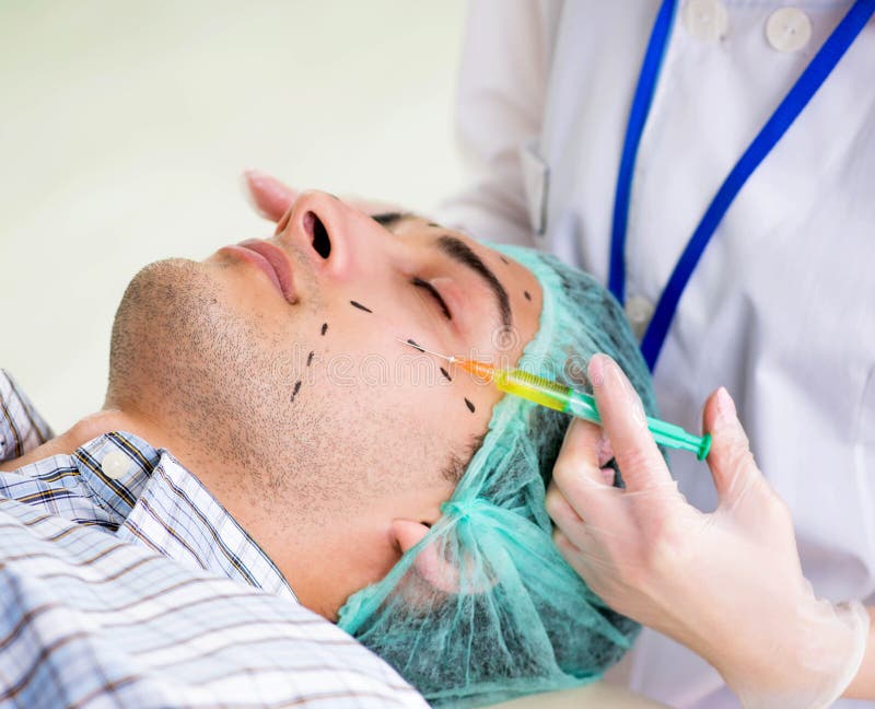 Plastic Surgeon Preparing for Operation on Man Face Stock Photo - Image ...