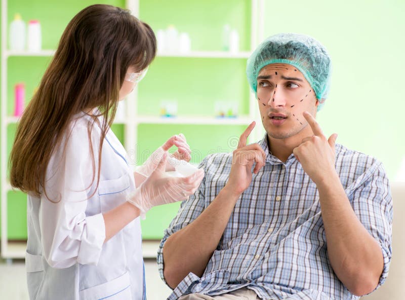 Plastic Surgeon Preparing for Operation on Man Face Stock Photo - Image ...