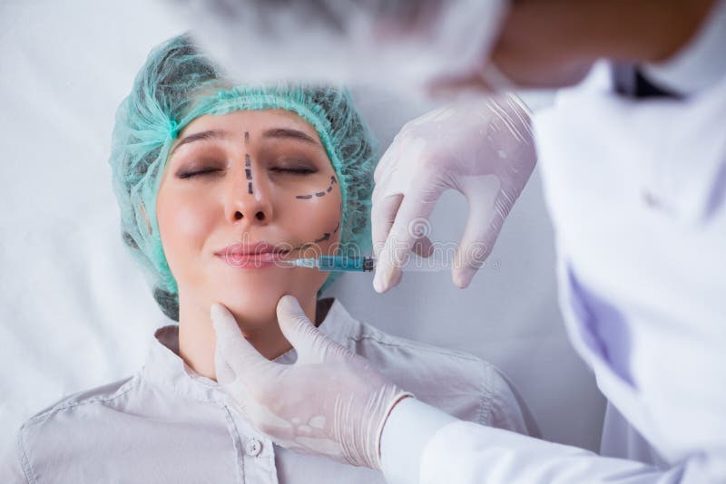 The Plastic Surgeon Preparing for Operation on Woman Face Stock Photo ...