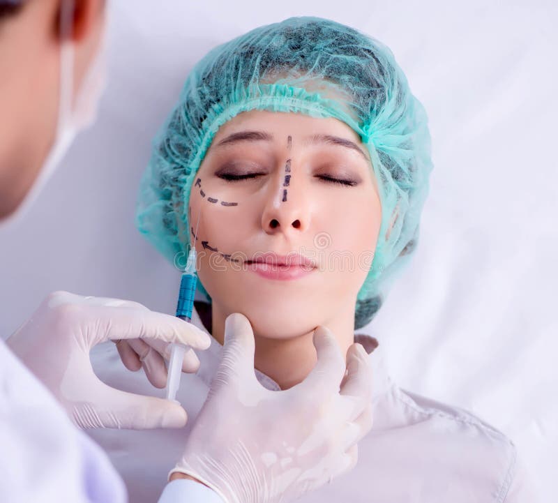 Plastic Surgeon Preparing for Operation on Woman Face Stock Image ...