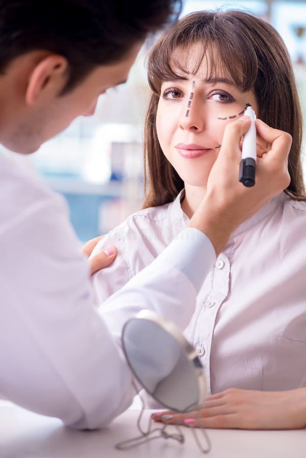 The Plastic Surgeon Preparing for Operation on Woman Face Stock Photo ...