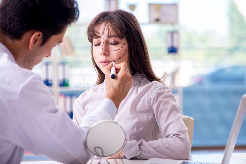 The Plastic Surgeon Preparing for Operation on Woman Face Stock Image ...