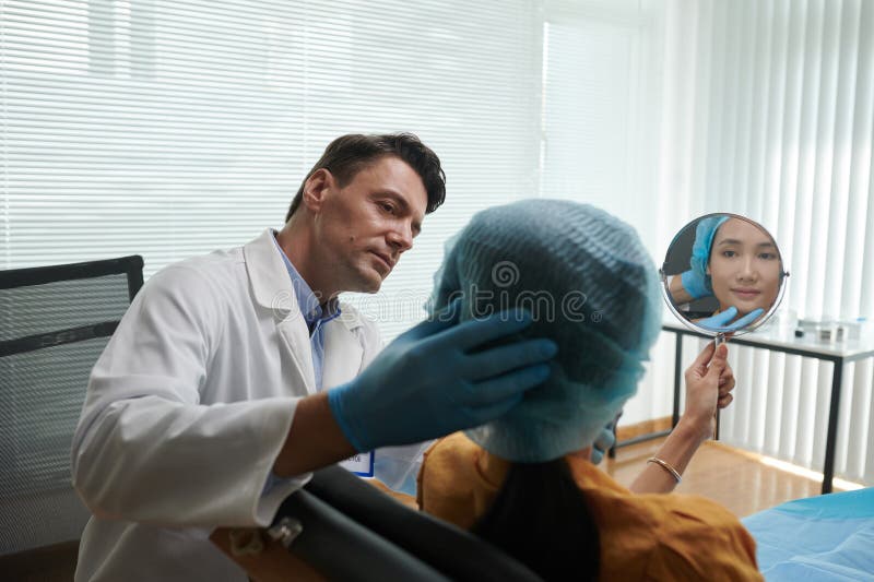 Plastic Surgeon Talking To Patient Stock Photo - Image of doctor ...