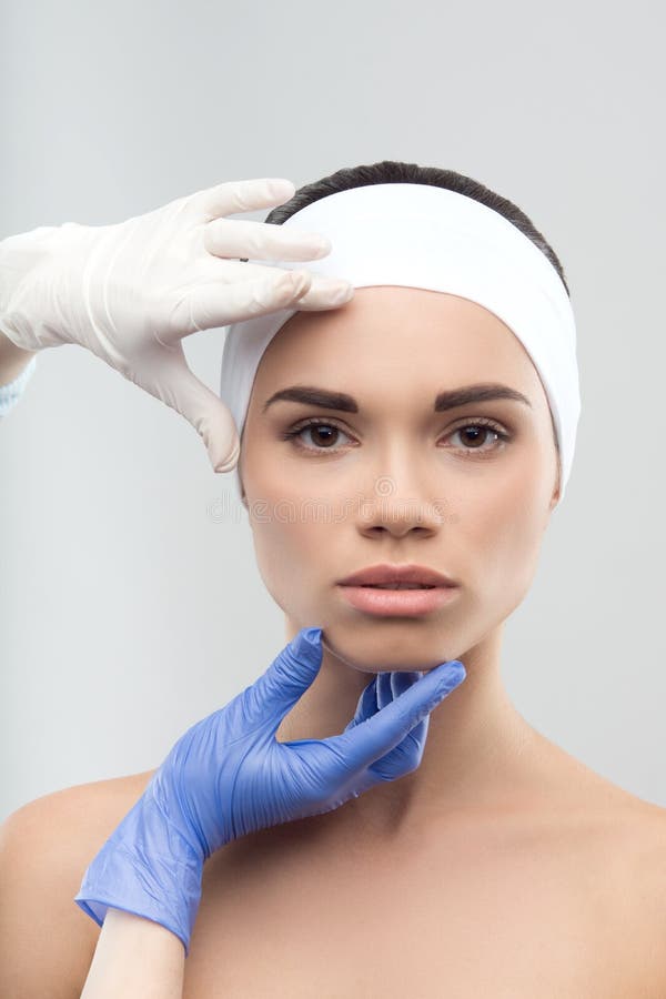 Plastic Surgeon Examining Woman Stock Image - Image of surgeon, modern ...