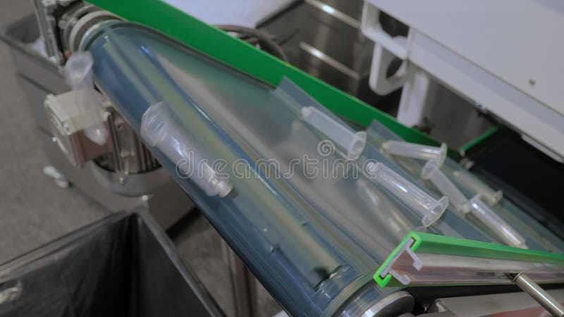 Plastic Syringes are Falling from the Conveyor Belt of Thermoplastic ...