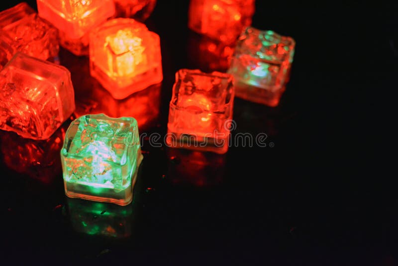 Beautiful and Bright Red Glowing Ice Cubes are Located on a Black ...