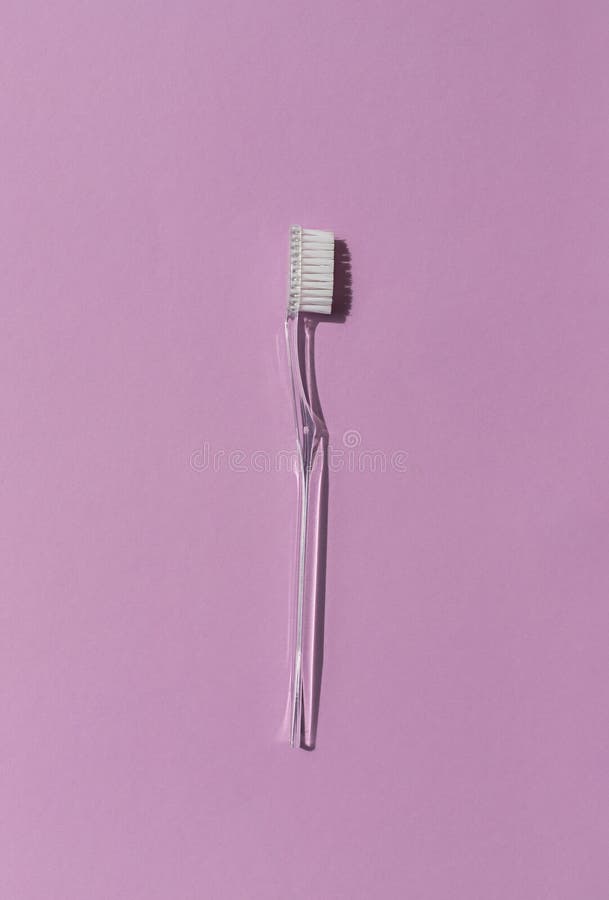 Plastic Toothbrush on the Bright Violet Background. Stock Photo - Image ...