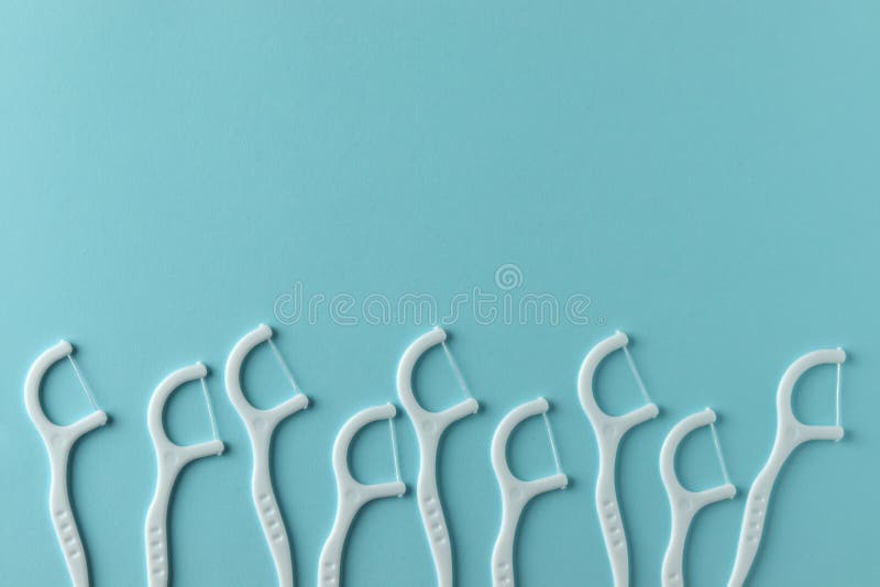 Plastic Toothpick with Dental Floss on Blue Background Stock Photo ...