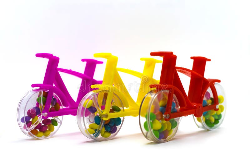 Plastic Toy Bicycle with Chocolate Nut Candy Inside the Bicycle Wheel ...