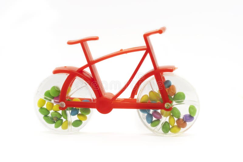 Plastic Toy Bicycle with Chocolate Nut Candy Inside the Bicycle Wheel ...
