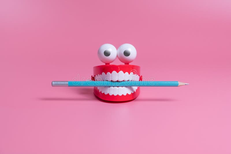 Plastic Toy with Pencil in Teeth Stock Photo - Image of dentist ...