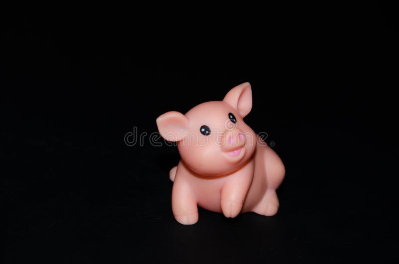 Plastic Toy Pig on a Black Background. Realistic Toy Copy Space Stock ...