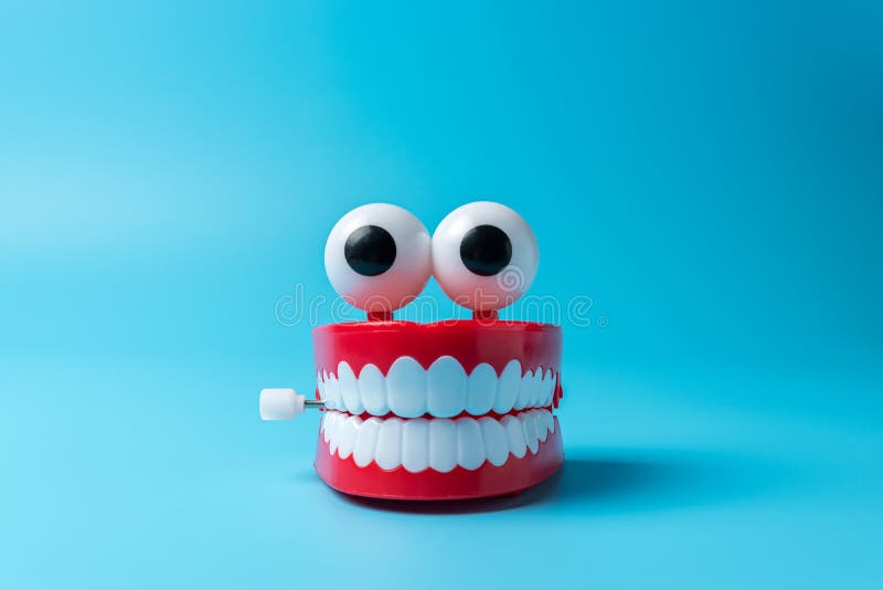 Plastic Toy Teeth on Blue Background. Abstract Minimal Composition ...