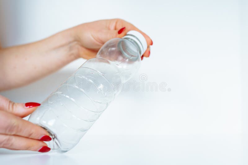 Plastic Transparent Bottle in Female Hands with Manicure Stock Image ...
