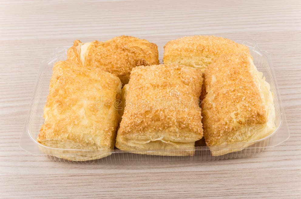 Plastic Transparent Box with Flaky Biscuits on Table Stock Image ...