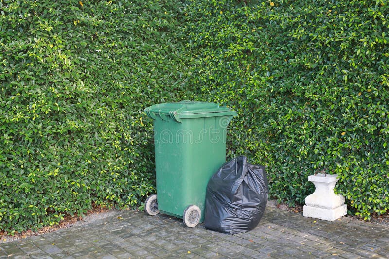 Plastic Trash Bags and Rubbish Bin in a Park Stock Photo - Image of ...