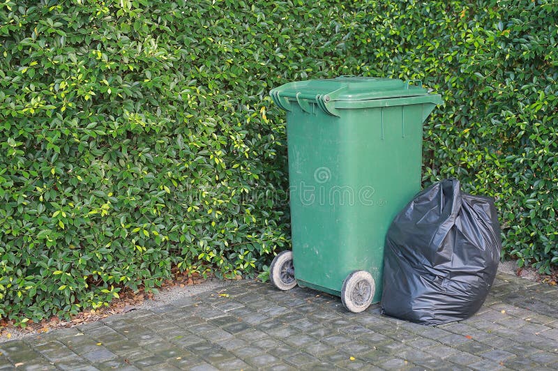Plastic Trash Bags and Rubbish Bin in a Park Stock Image - Image of ...