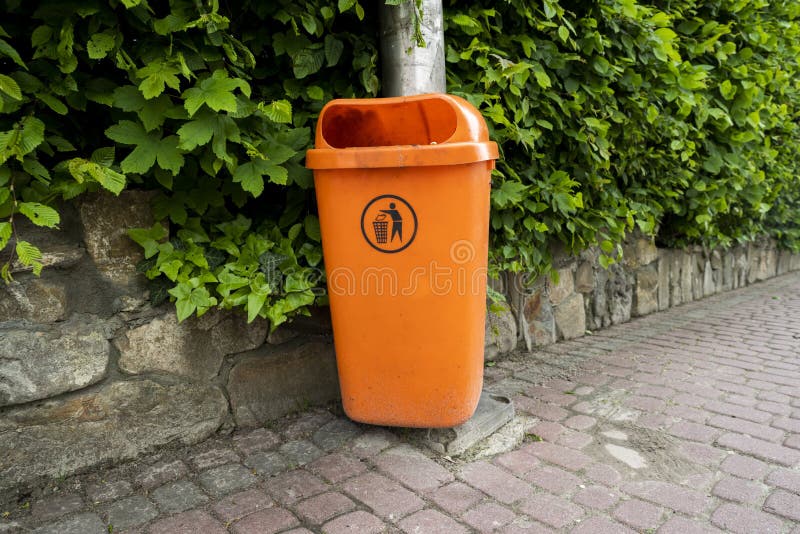 Orange Plastic Public Trash Cans at Pole Stock Image - Image of ...