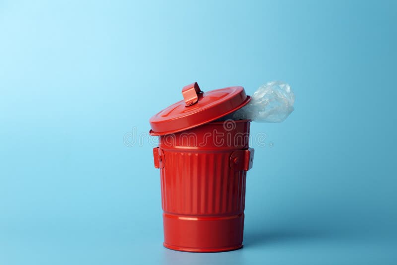 Plastic Trash and Waste in a Trash Bin on a Blue Background. Waste and ...