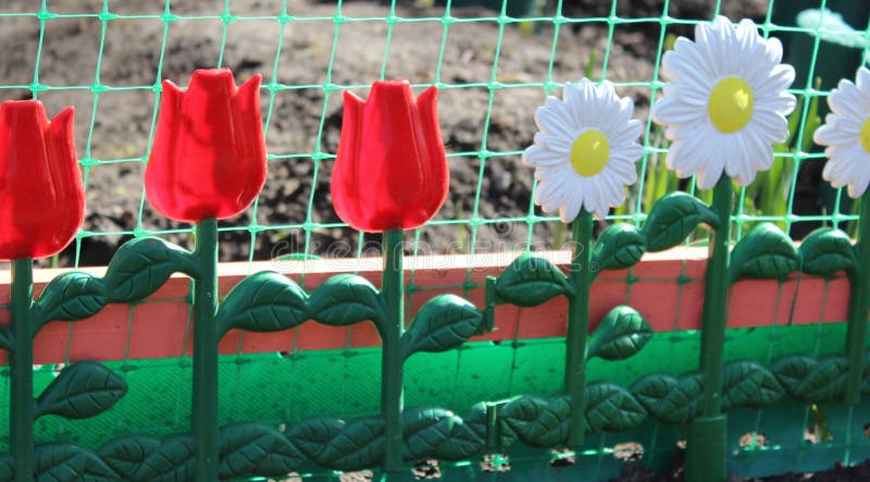 Plastic Tulips and Daisies in the Garden in Spring Stock Illustration ...
