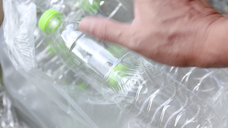 Plastic Waste, Hand are Plastic Waste Bottle and Sorting it into a Bag ...