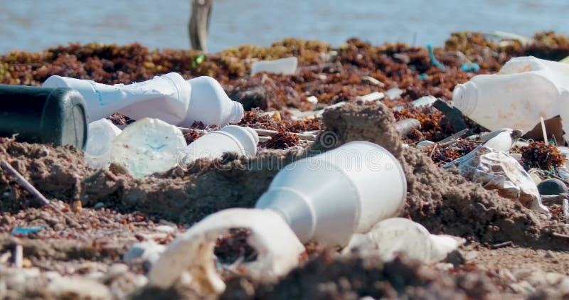 Slow Pan of Plastic Trash Littered on Beach Stock Footage - Video of ...